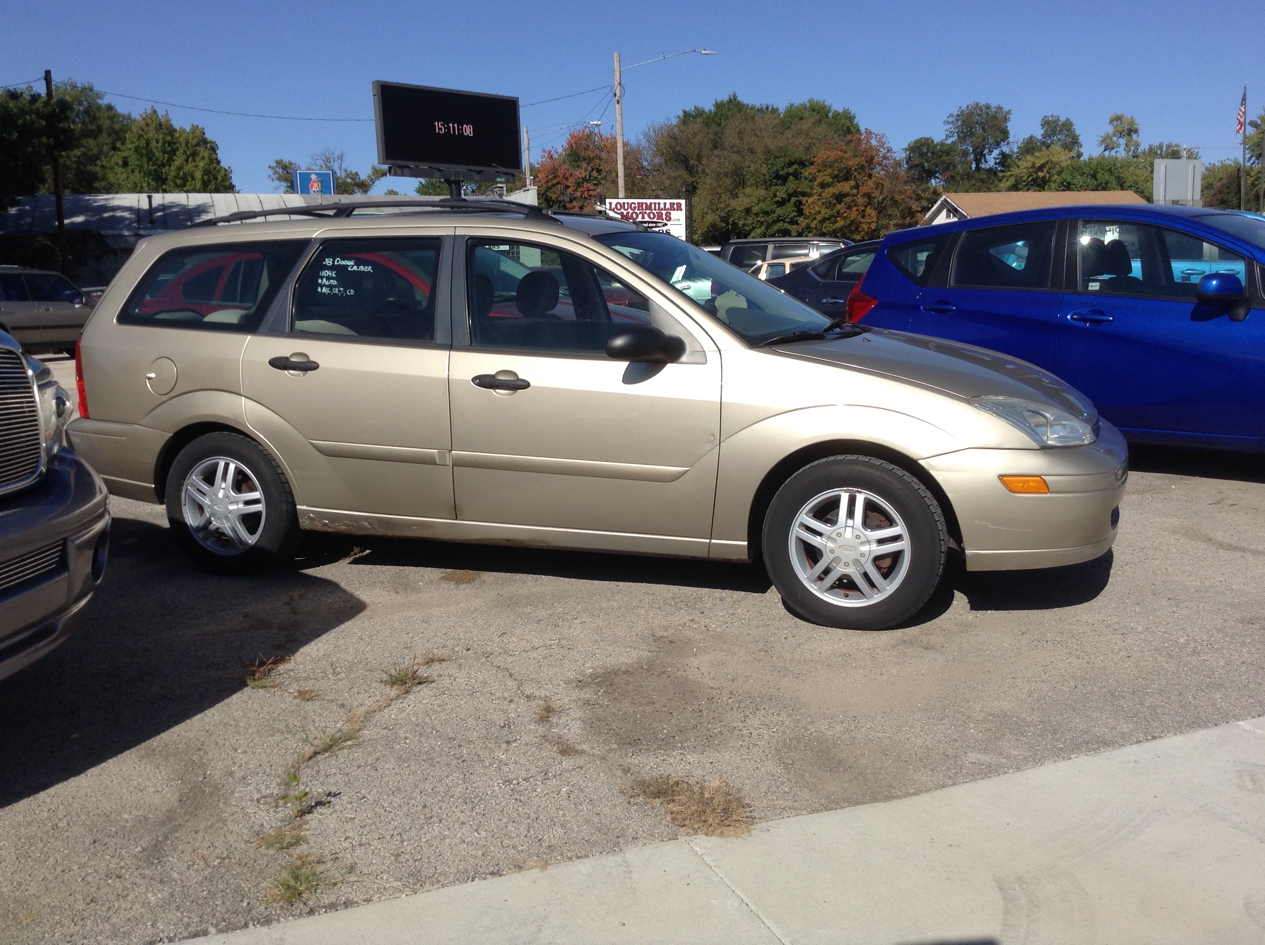 Gold, cloth interior, 4 cylinder, auto, front-wheel drive, 4 door, a/c ...