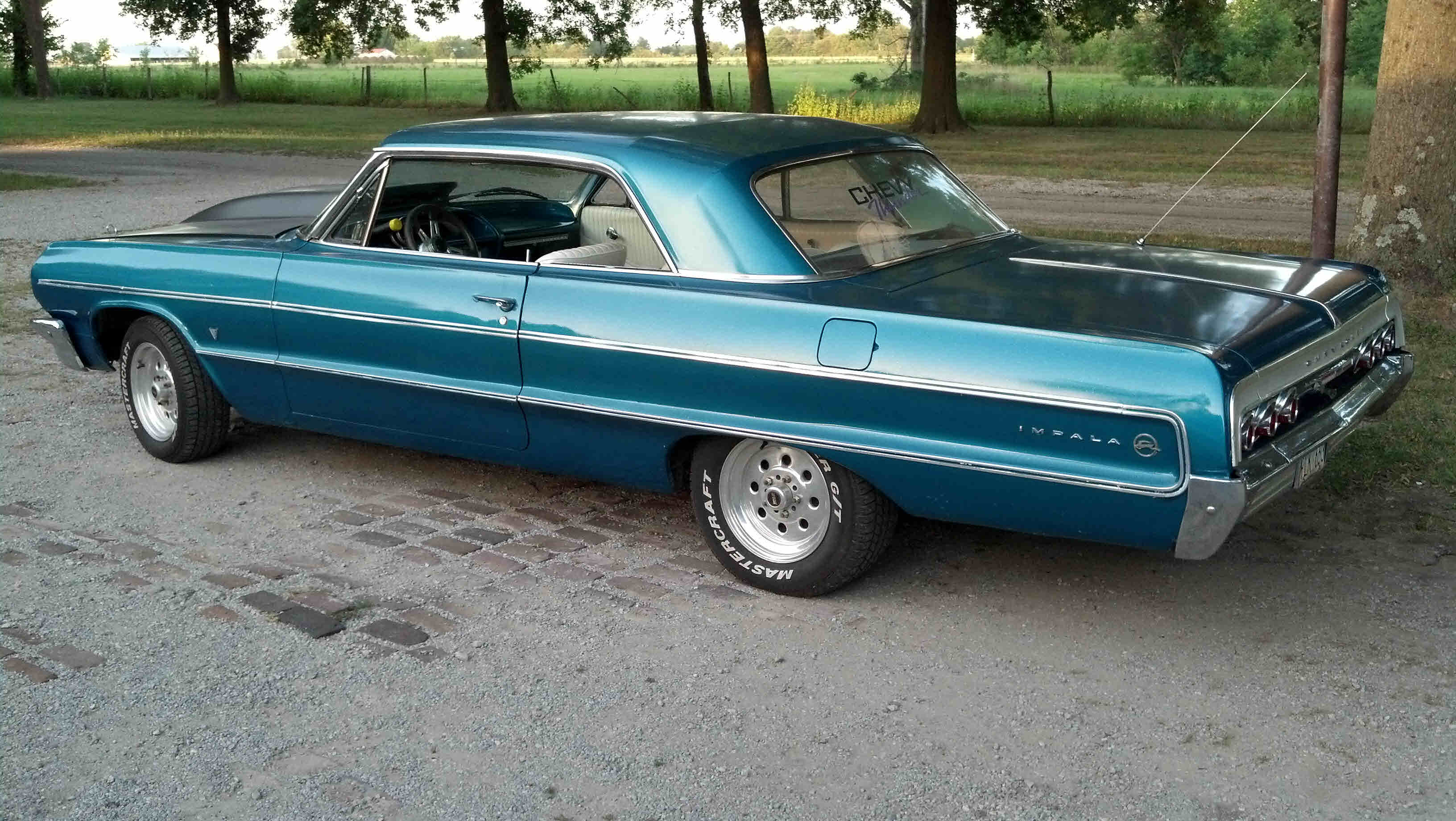 Blue-green, white vinyl interior, 350 V-8, auto, tilt wheel, alloy ...